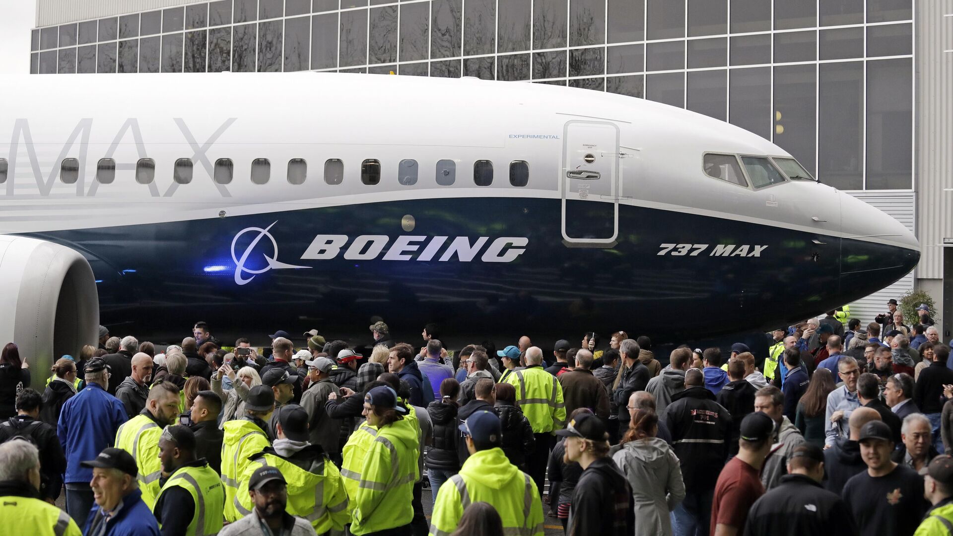 Boeing employees surround the 737 MAX, the MAX 7, after it rolled out ...